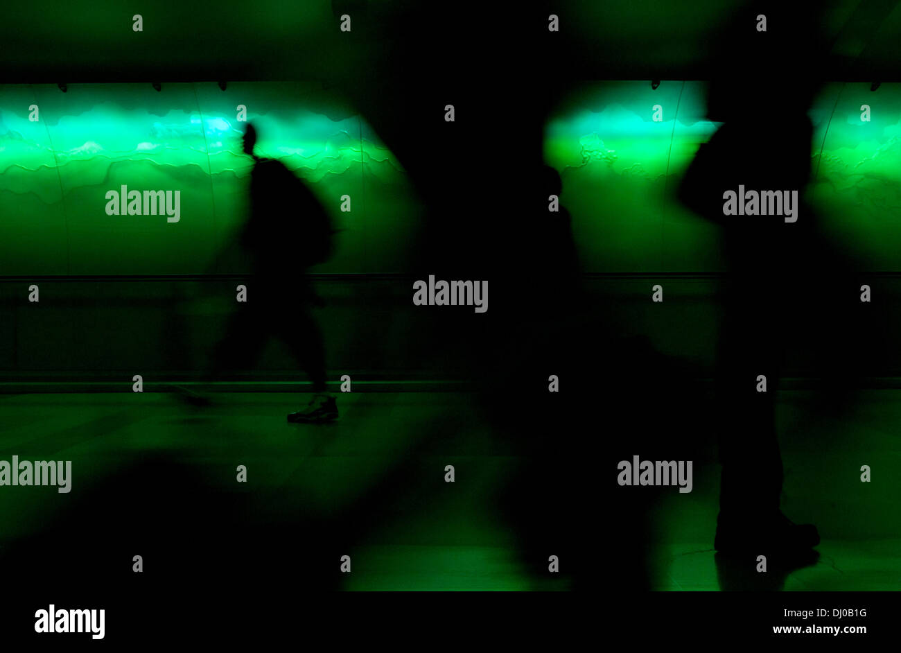 Travelers move through the green light in the Detroit airport Stock ...