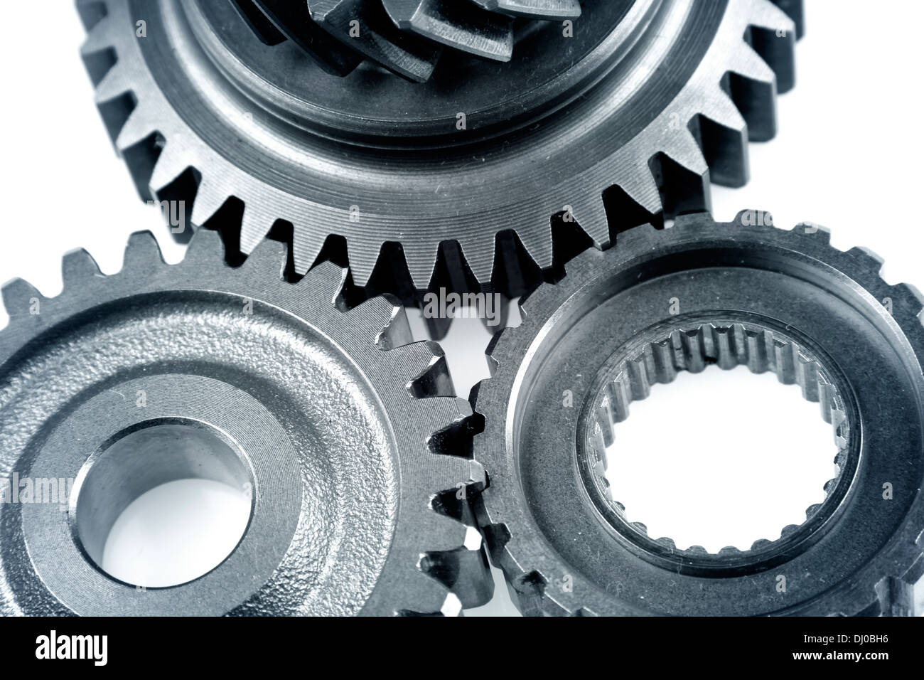 Closeup of three metal cog gears Stock Photo - Alamy