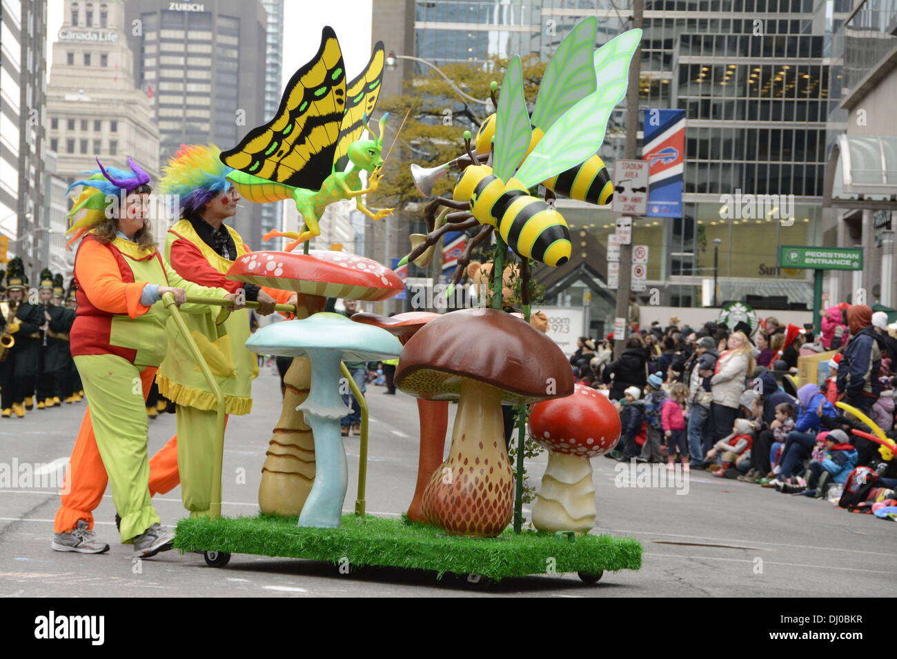 Toronto, Canada. 17th Nov 2013. A hand cart float with bees and ...