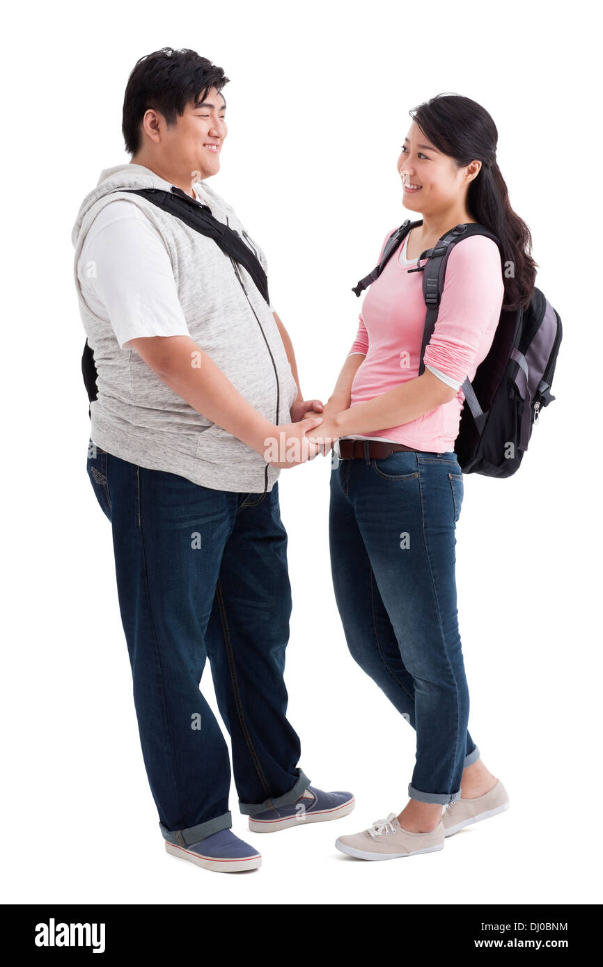 College couple holding hands Cut Out Stock Images & Pictures - Alamy