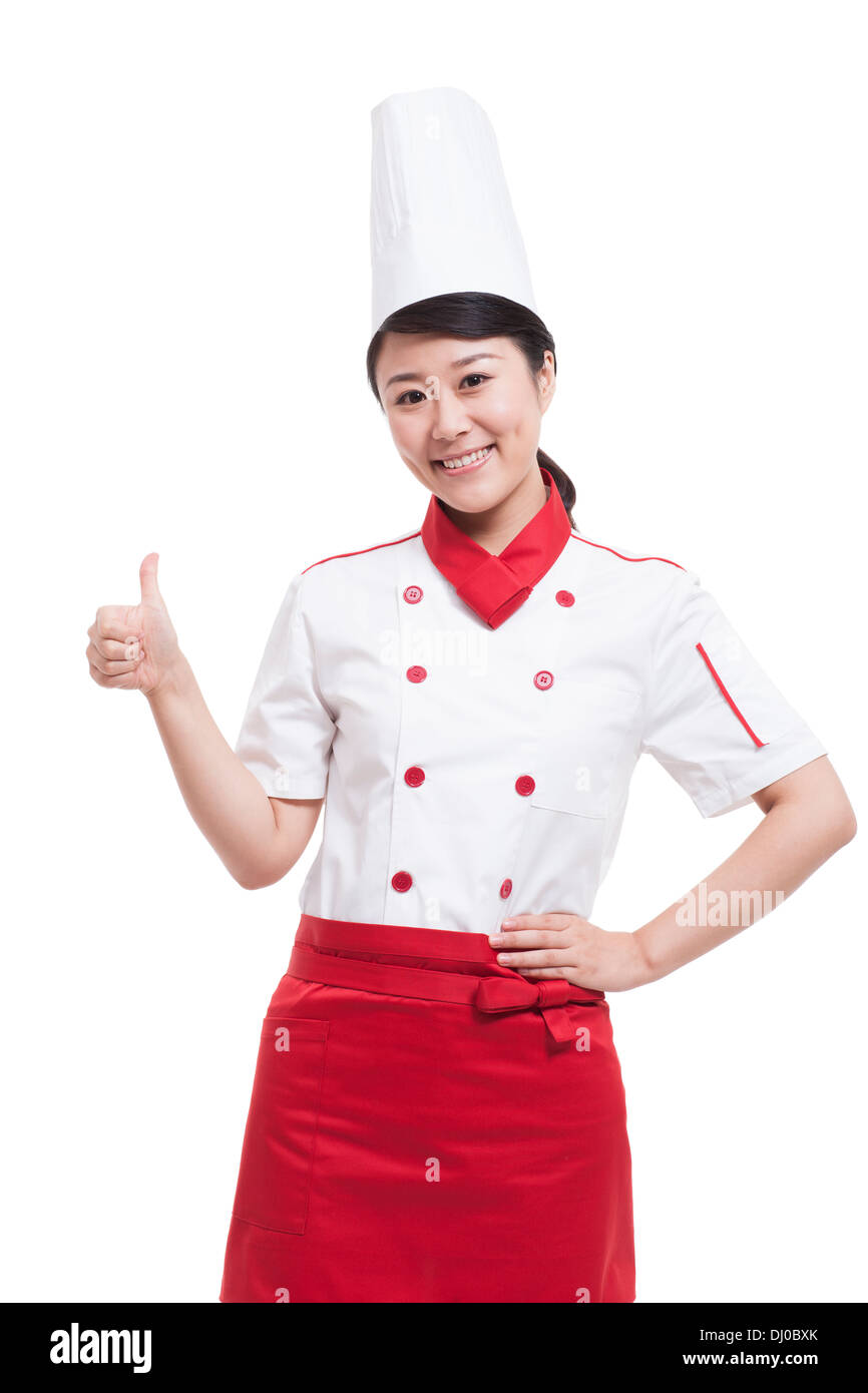 Female cook doing thumbs up Stock Photo - Alamy