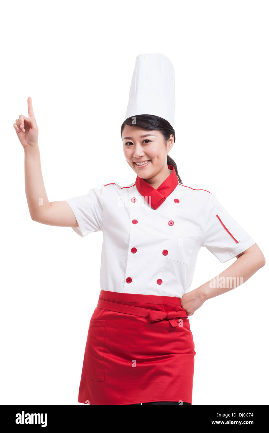 Female cook pointing up Stock Photo - Alamy