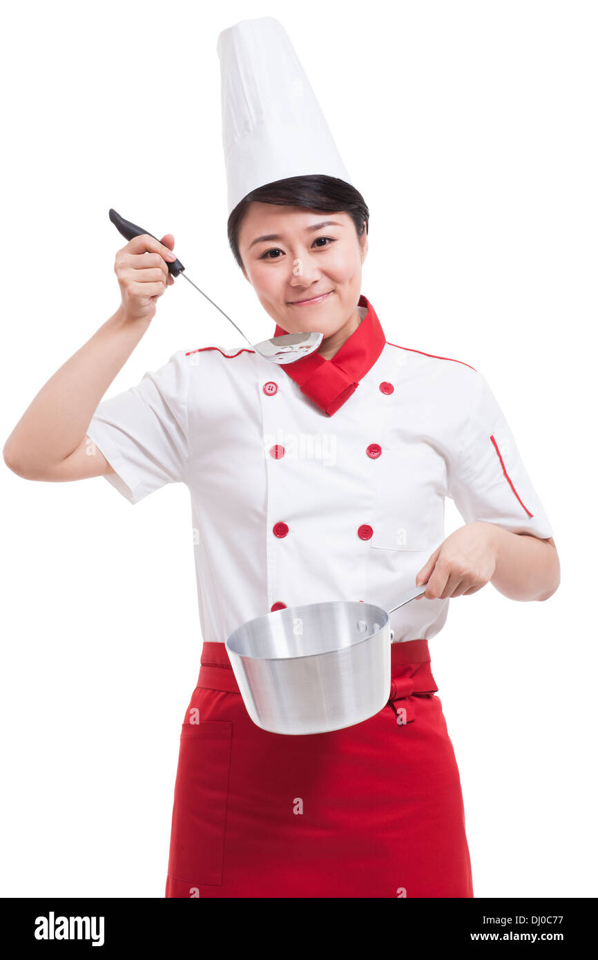 Female cook doing taste test Stock Photo - Alamy