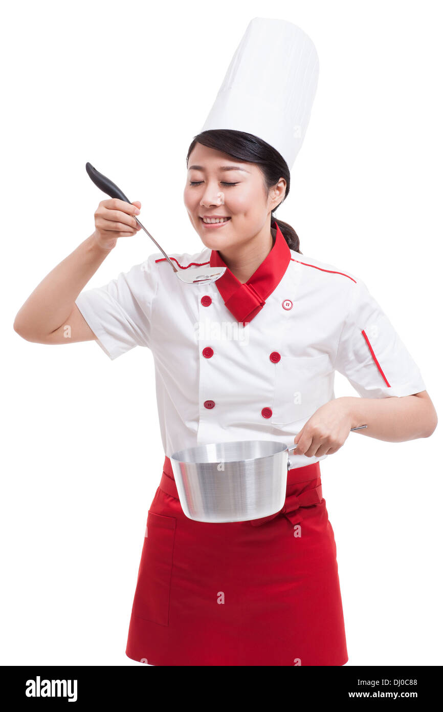 Female cook doing taste test Stock Photo - Alamy