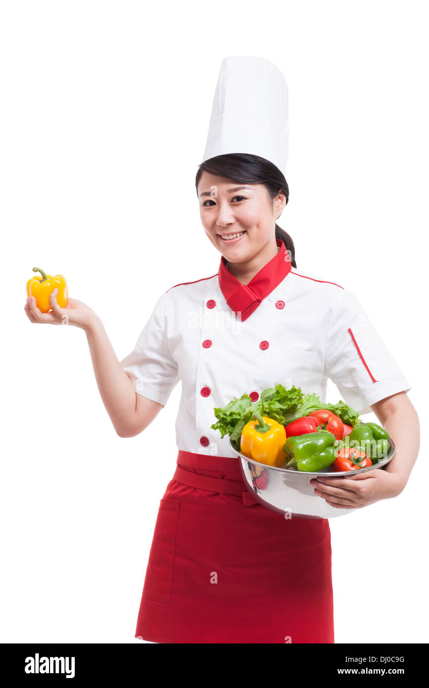 Female cook with bell pepper Stock Photo - Alamy