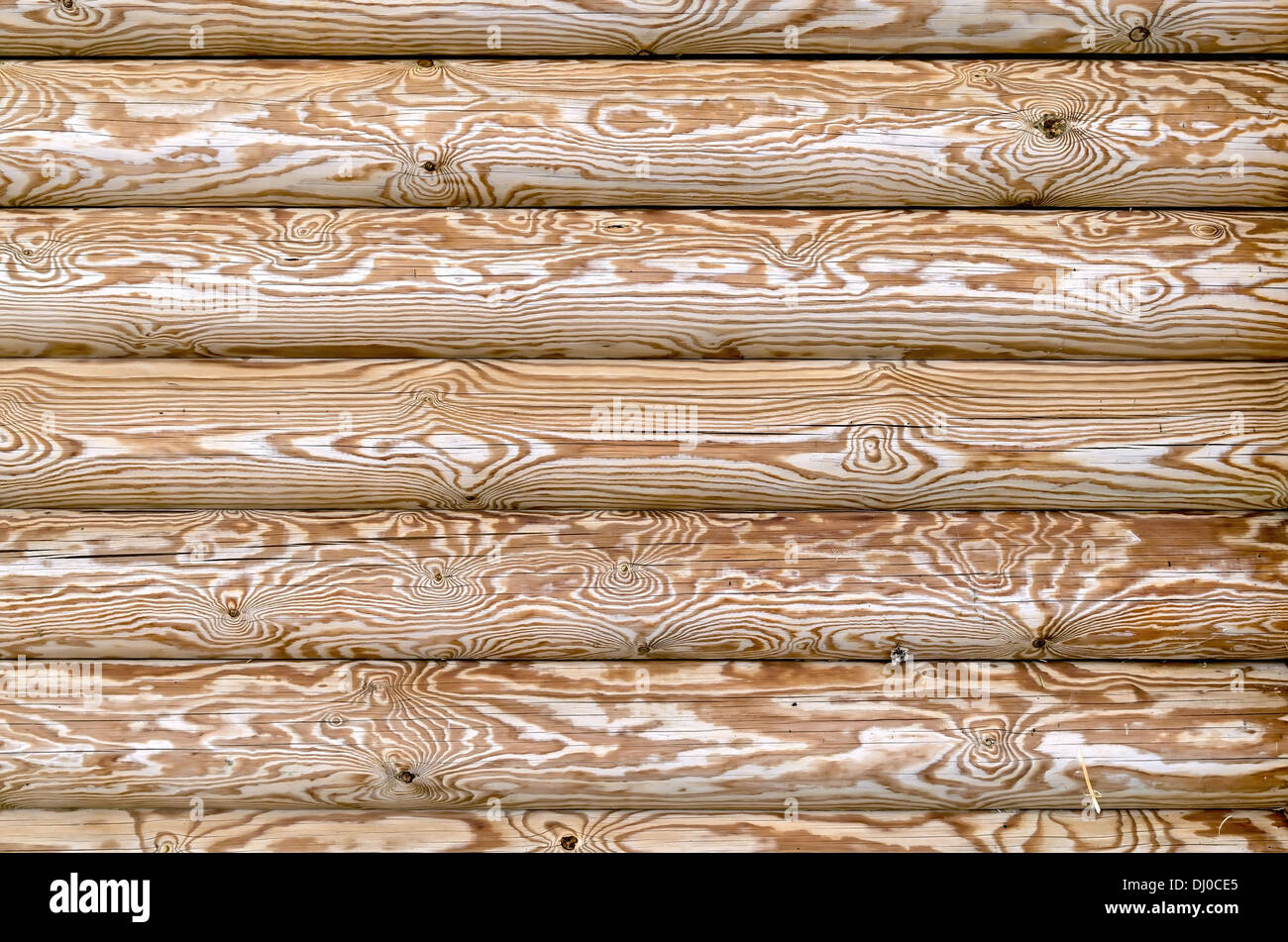 Texture of stacked logs in the wall of the house Stock Photo - Alamy