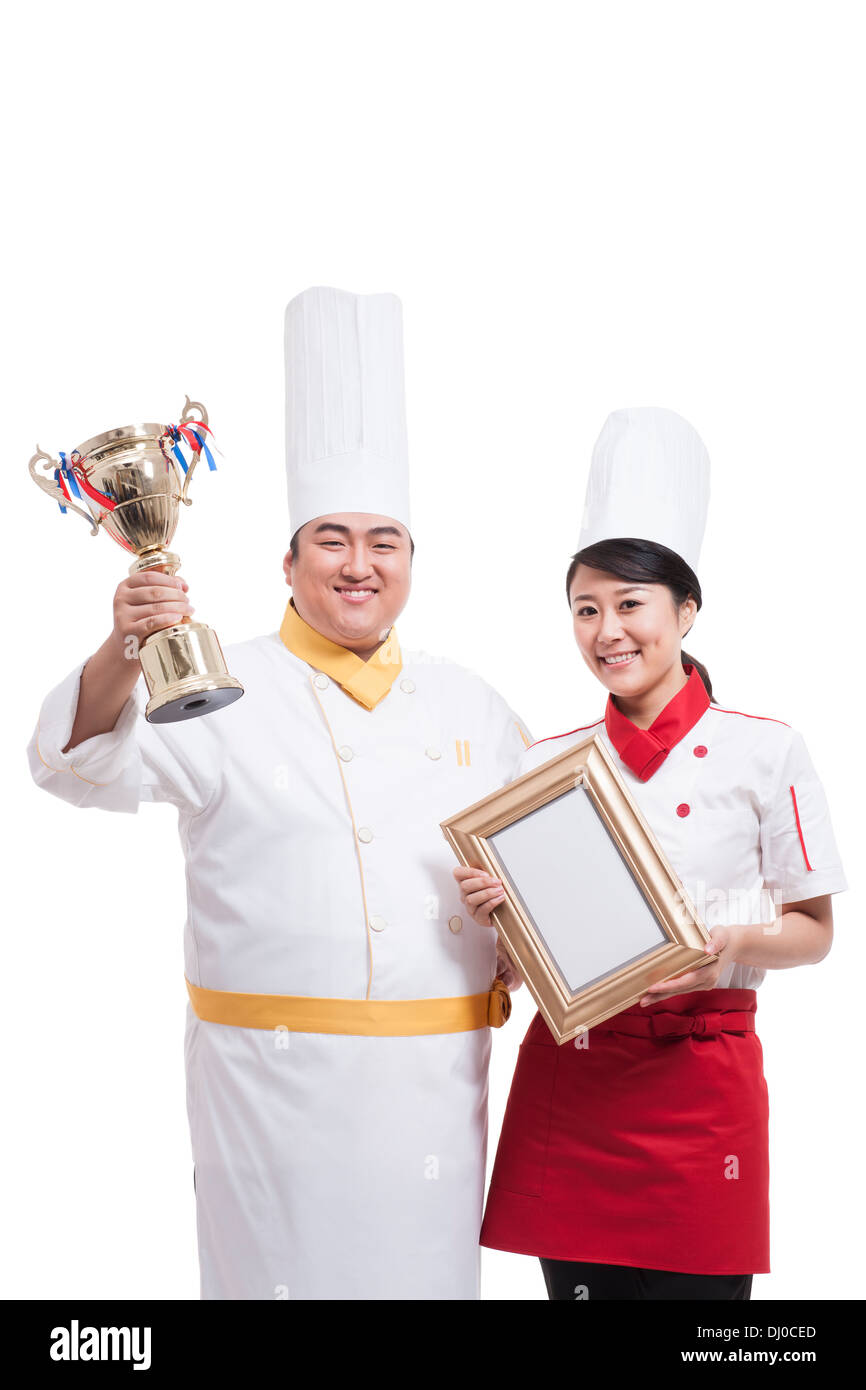 Cooks with trophy and certificate Stock Photo - Alamy