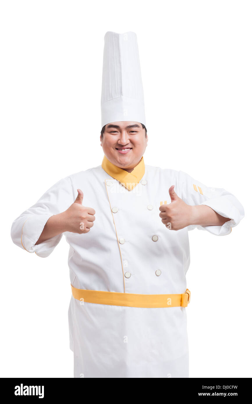 Cheerful Chubby cook doing thumbs up Stock Photo - Alamy