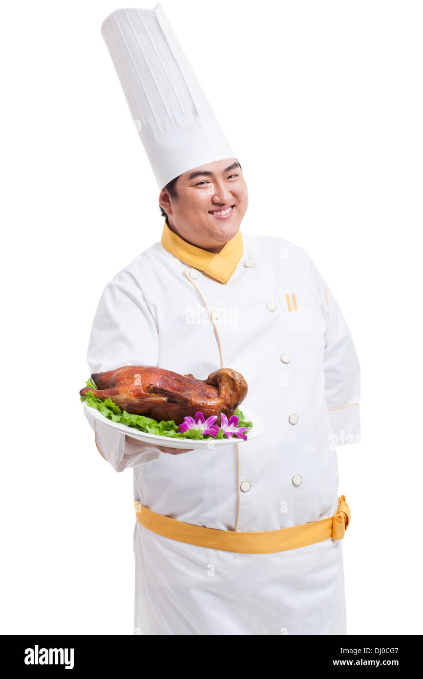 Chubby cook with roast duck Stock Photo - Alamy
