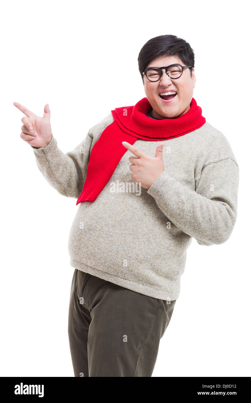 Excited young man celebrating Chinese New Year Stock Photo - Alamy