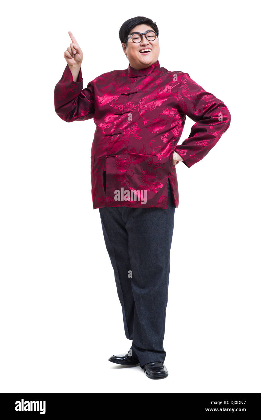 Happy young man in Tang suit pointing Stock Photo - Alamy