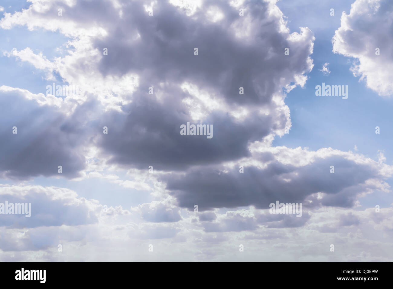 dramatic stormy blue sky with grey clouds and sun rays Stock Photo - Alamy