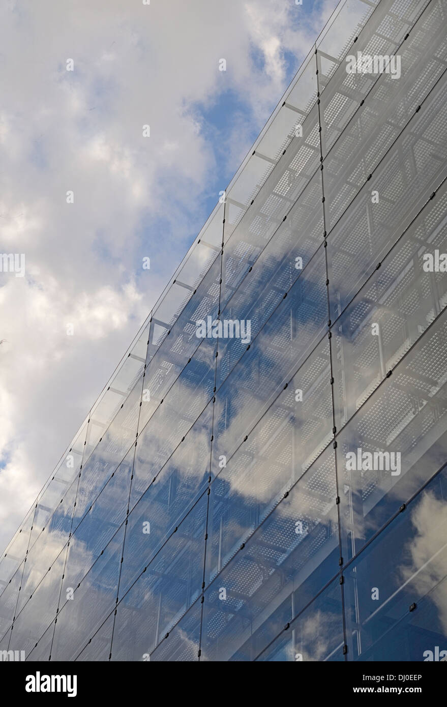 Cloudy reflections on a business building Stock Photo - Alamy