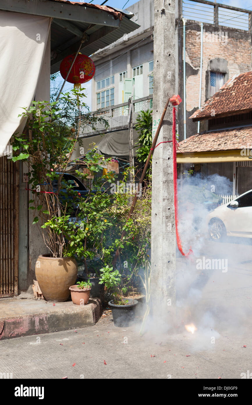 Firecrackers exploding for Chinese new year, Thailand Stock Photo - Alamy