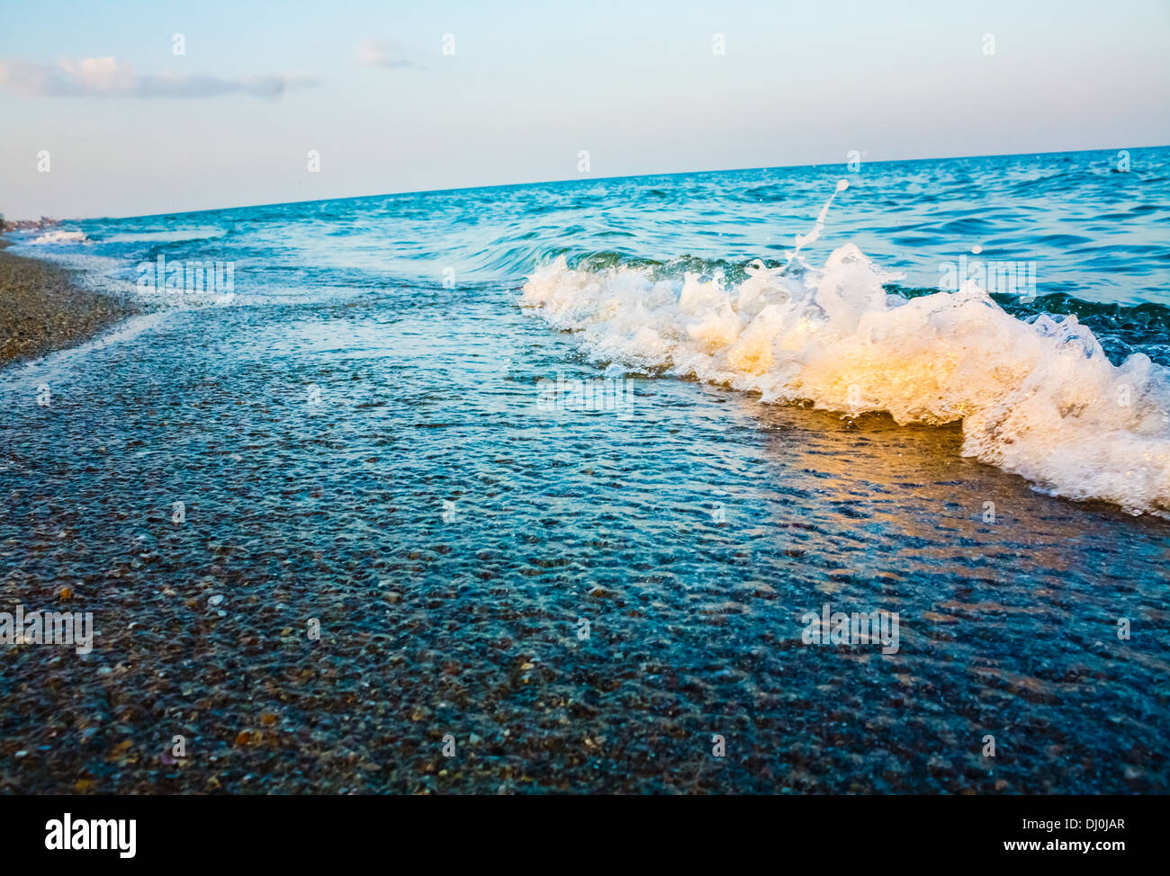 Soft sea ocean waves wash over sand background. Sunset, sunrise Stock ...