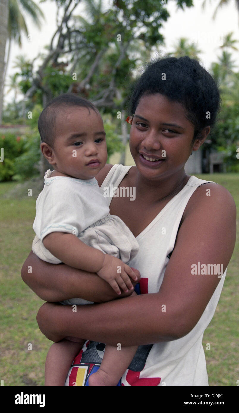 Young polynesian girl whit her relative baby Stock Photo - Alamy