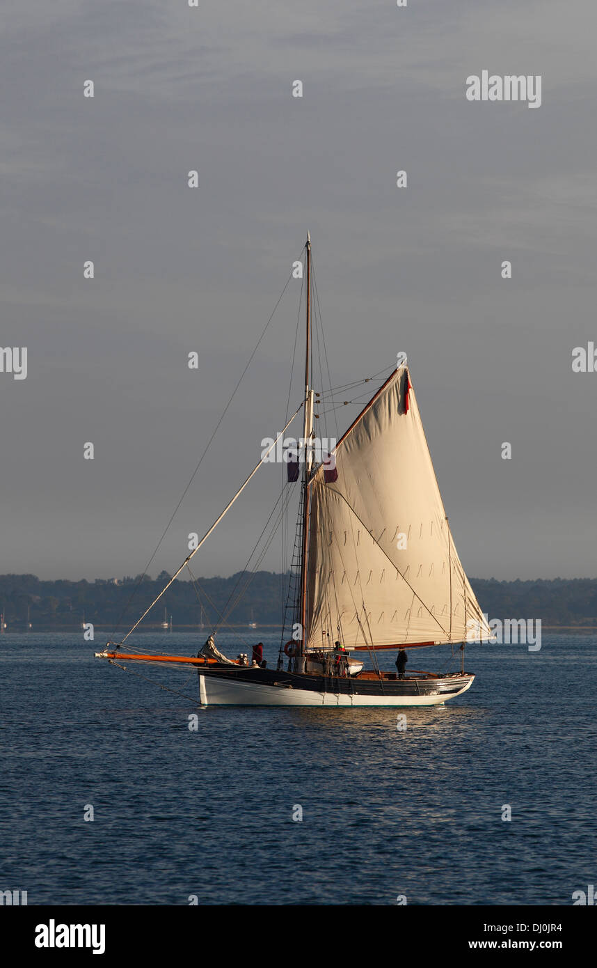 Sloop and crew on Solent Isle of Wight Hampshire England Stock Photo ...