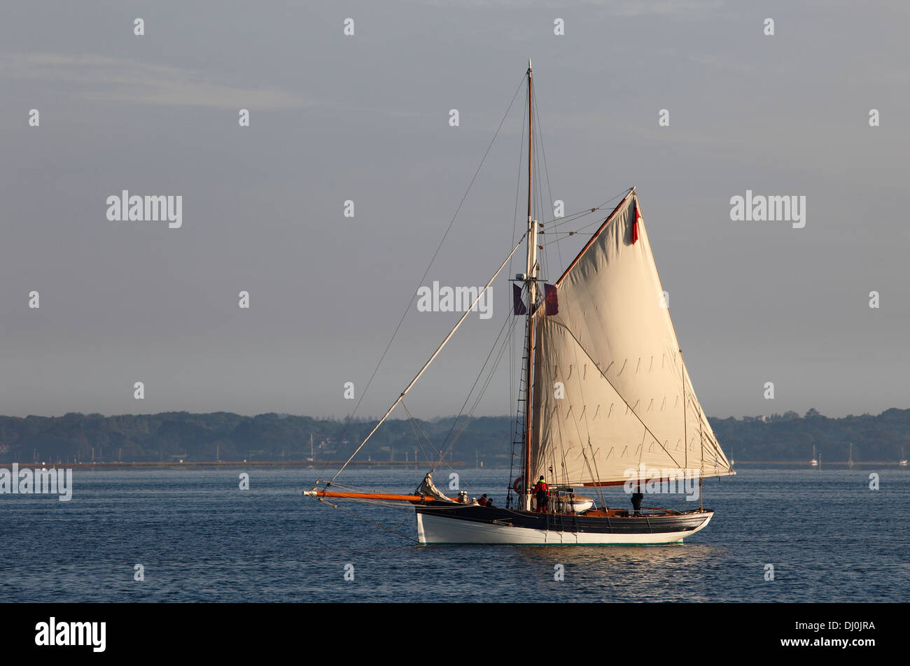 Sloop and crew on Solent Isle of Wight Hampshire England Stock Photo ...
