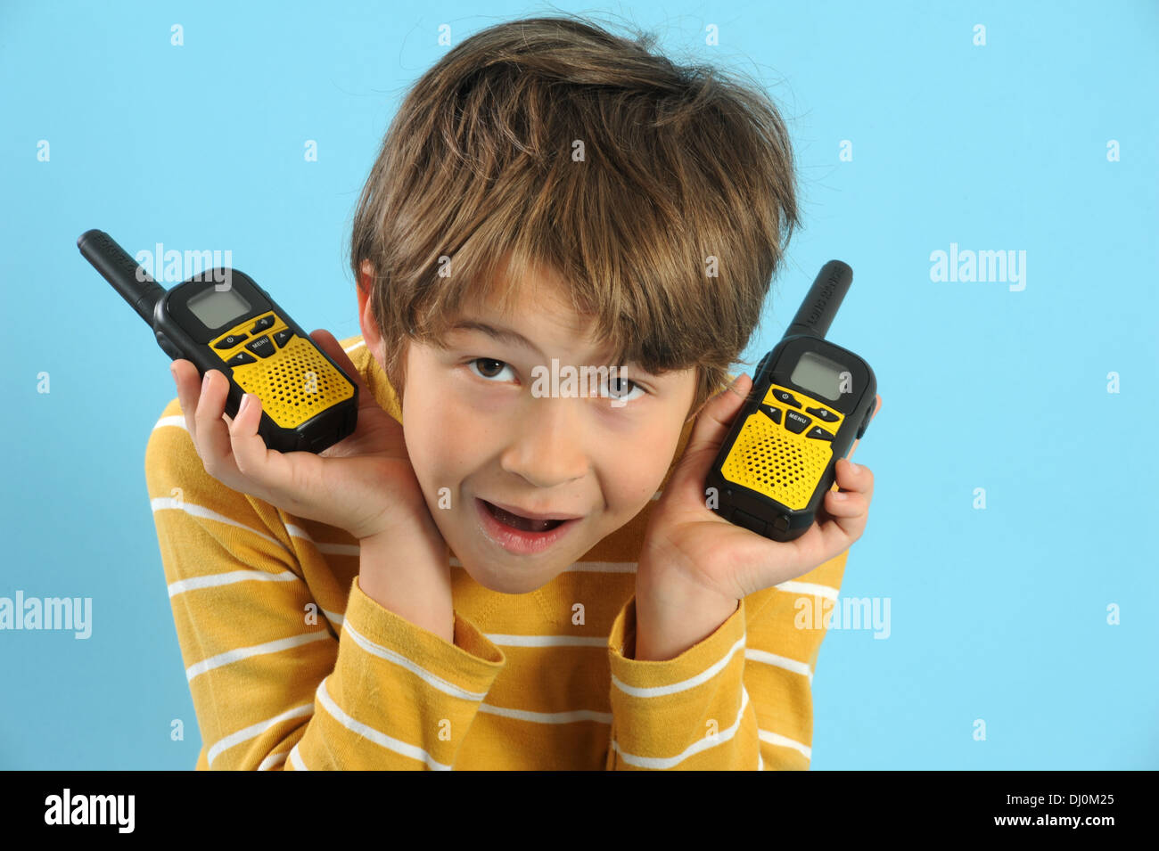 Boy talking with a walkie talkie Stock Photo - Alamy