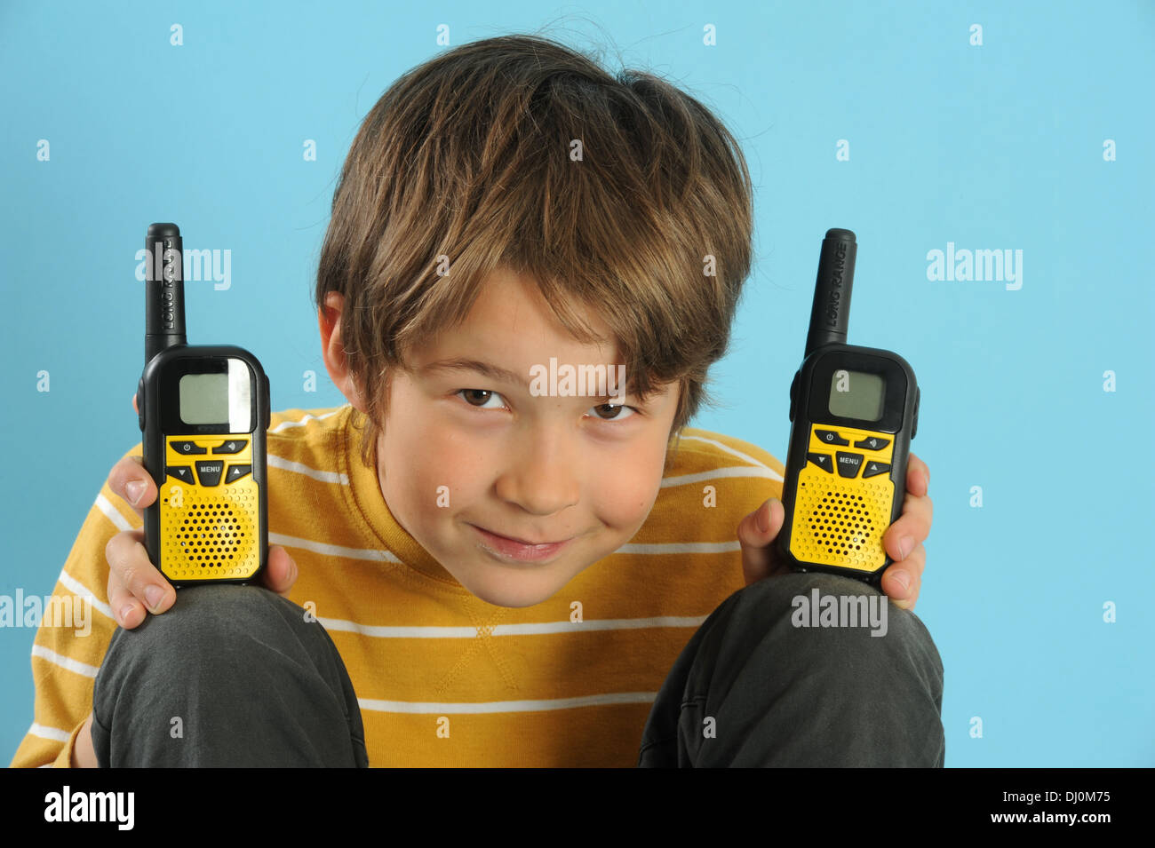 Boy talking with a walkie talkie Stock Photo - Alamy