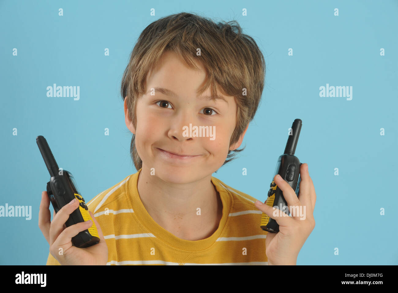 Boy talking with a walkie talkie Stock Photo - Alamy