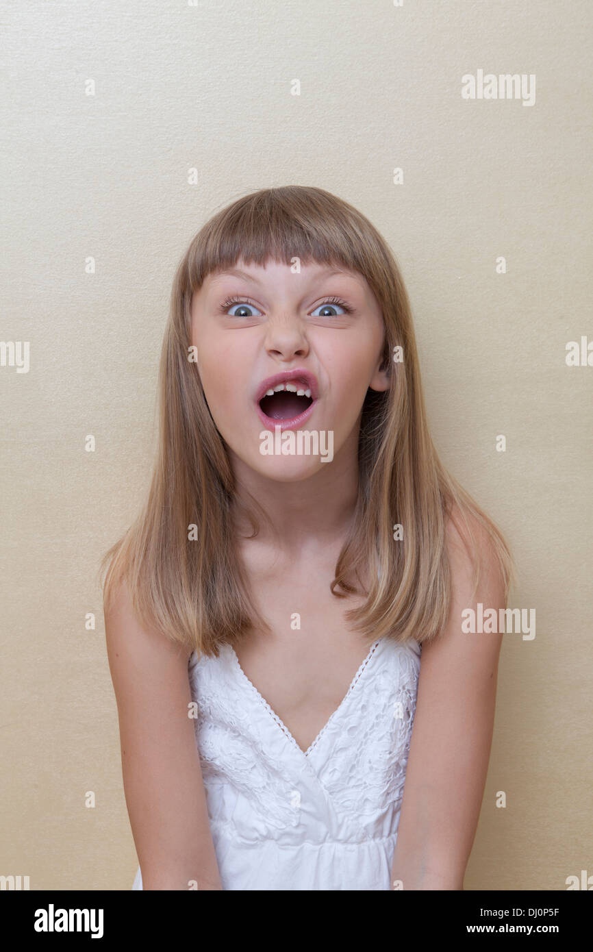 Little girl make a grimace Stock Photo - Alamy