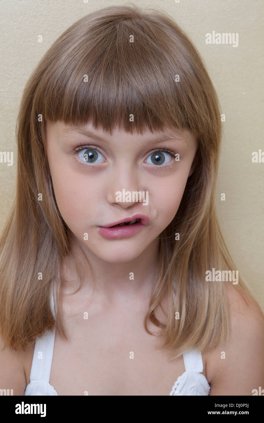 Little girl make a grimace Stock Photo - Alamy