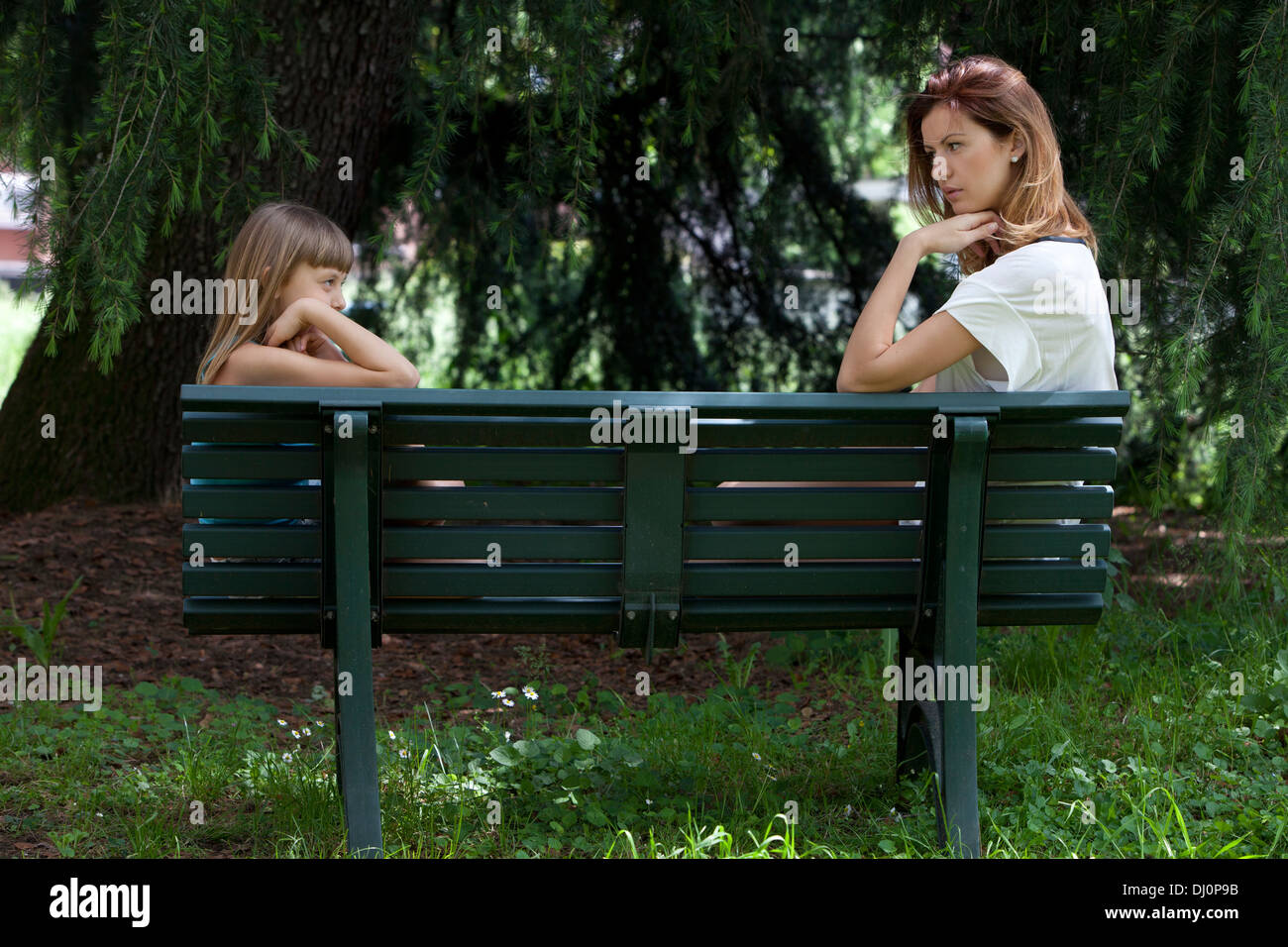 mother and daughter sitting on a bench Stock Photo - Alamy