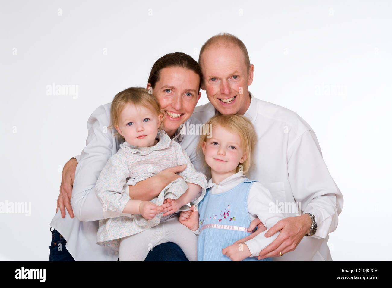 Family group portrait of a mum / mother and dad / father with 2 / two ...
