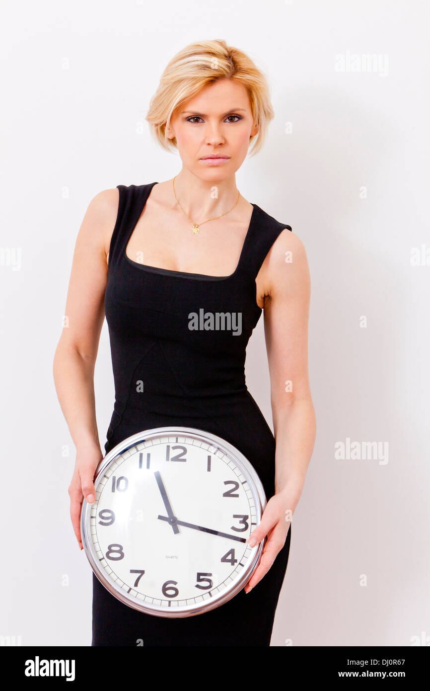 woman with wall clock Stock Photo - Alamy