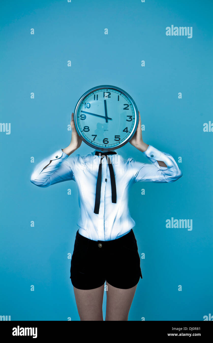 woman with wall clock Stock Photo - Alamy