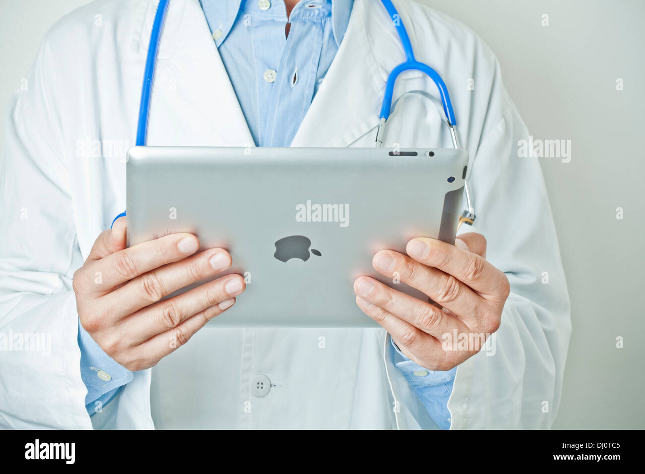 Doctor holding ipad hi-res stock photography and images - Alamy