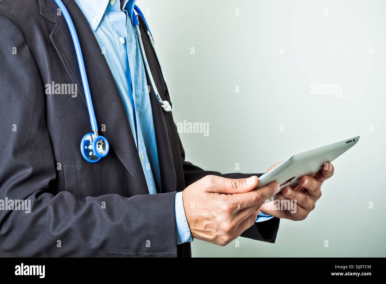 Doctor holding ipad hi-res stock photography and images - Alamy