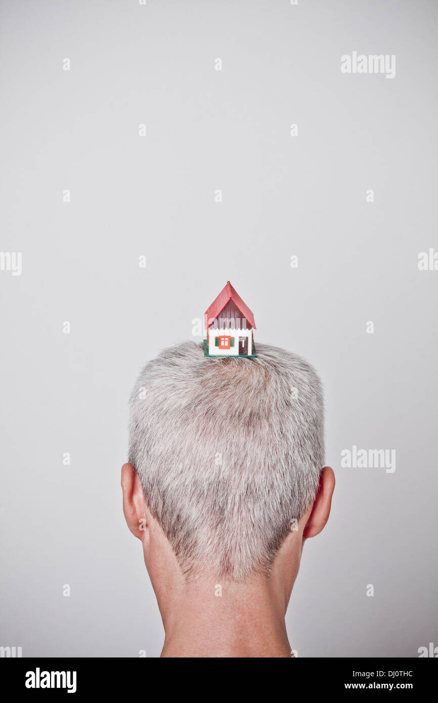 Man Wearing Paper House on Head Stock Photo - Alamy