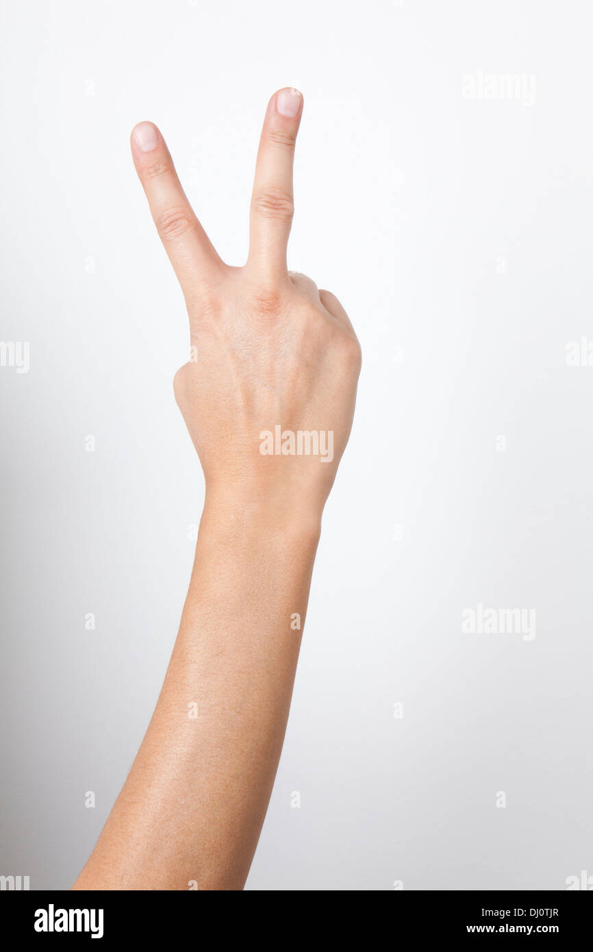 hand making peace sign Stock Photo - Alamy