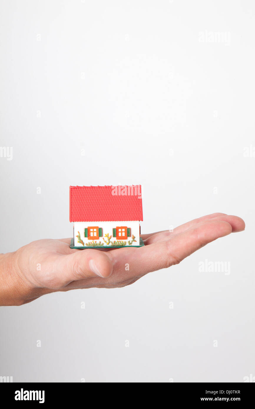 small house in hand Stock Photo - Alamy