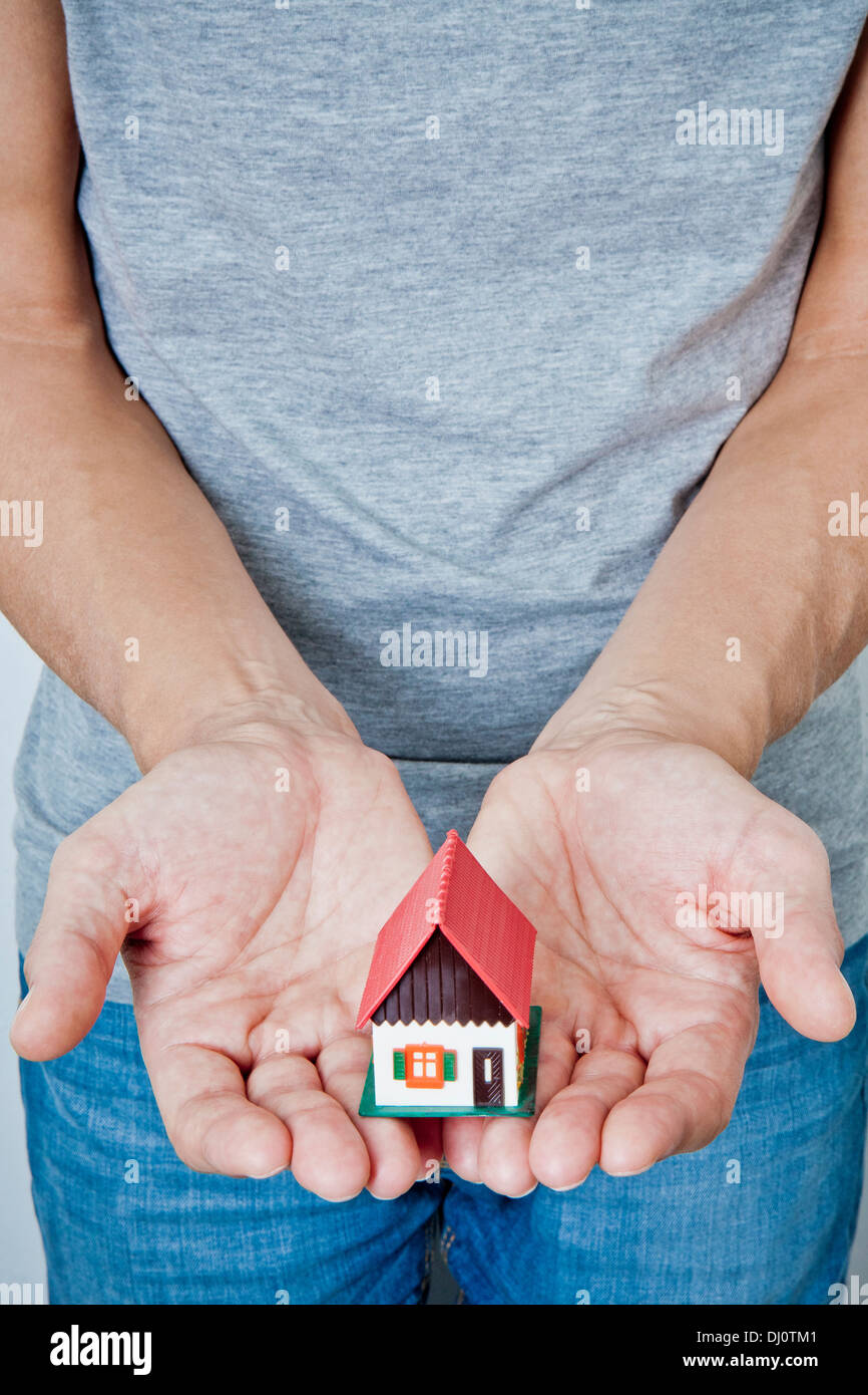 small house in hands Stock Photo - Alamy
