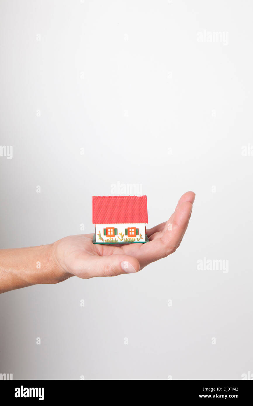 small house in hand Stock Photo - Alamy