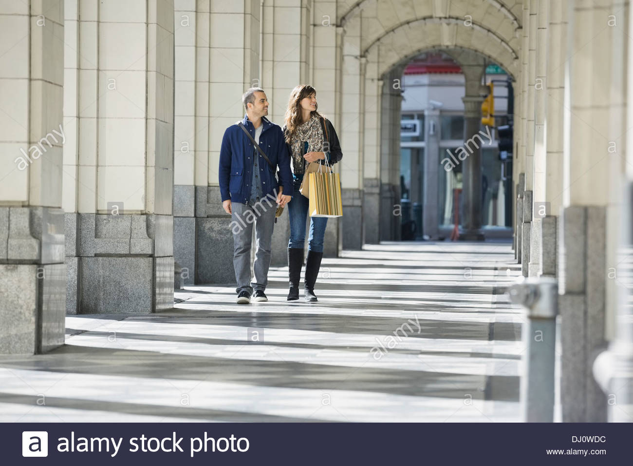 Two people walking with shopping hi-res stock photography and images ...