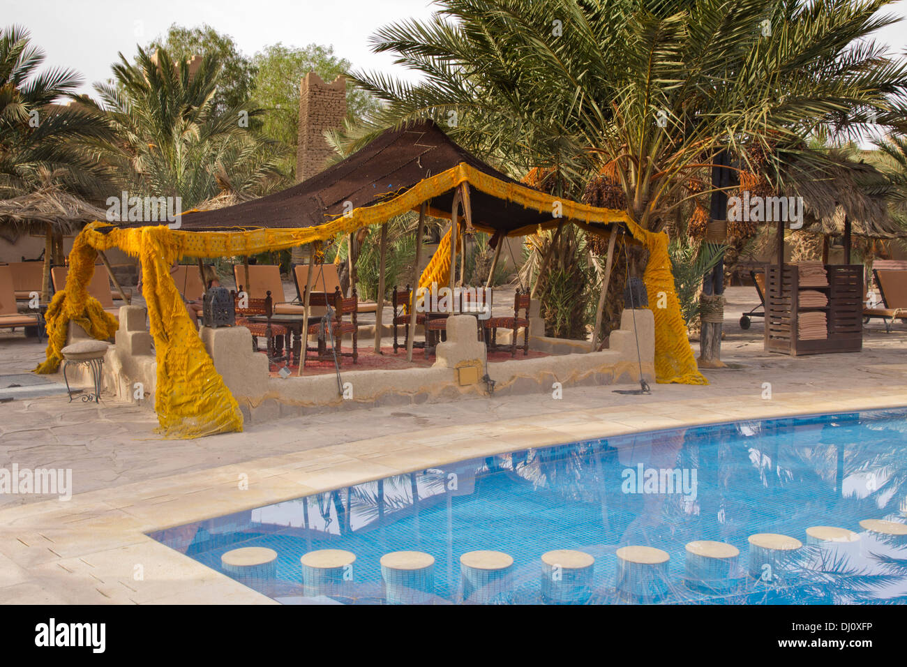 Moroccan hotel poolside seating area Stock Photo - Alamy