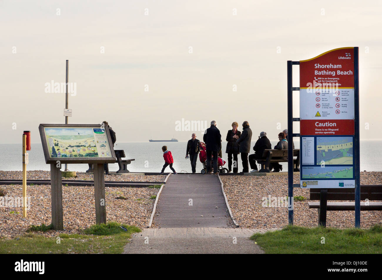People gathering on Shoreham Bathing Beach on a Saturday afternoon in ...