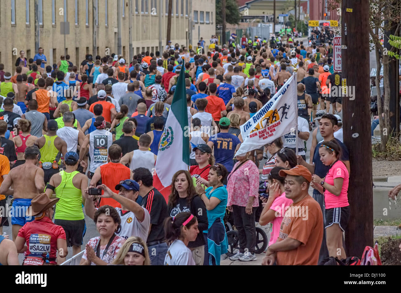 The crowd waiving flags and cheering on runners at the 2013 Rock and ...