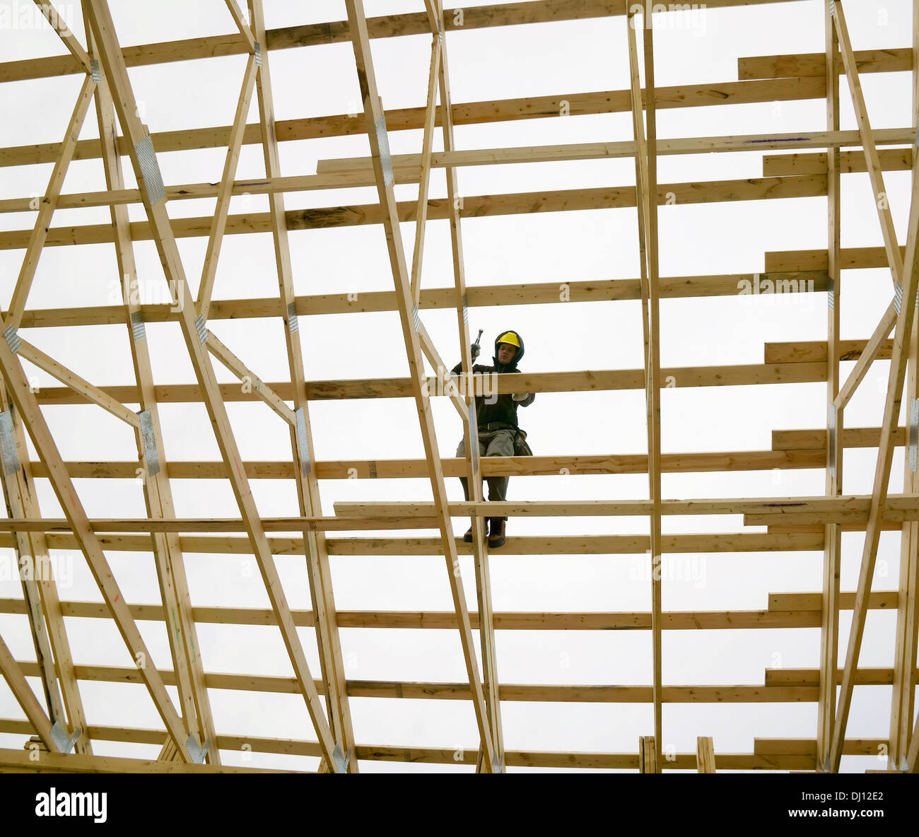 Construction Worker On Wooden Framework Of Building; Canada Stock Photo ...