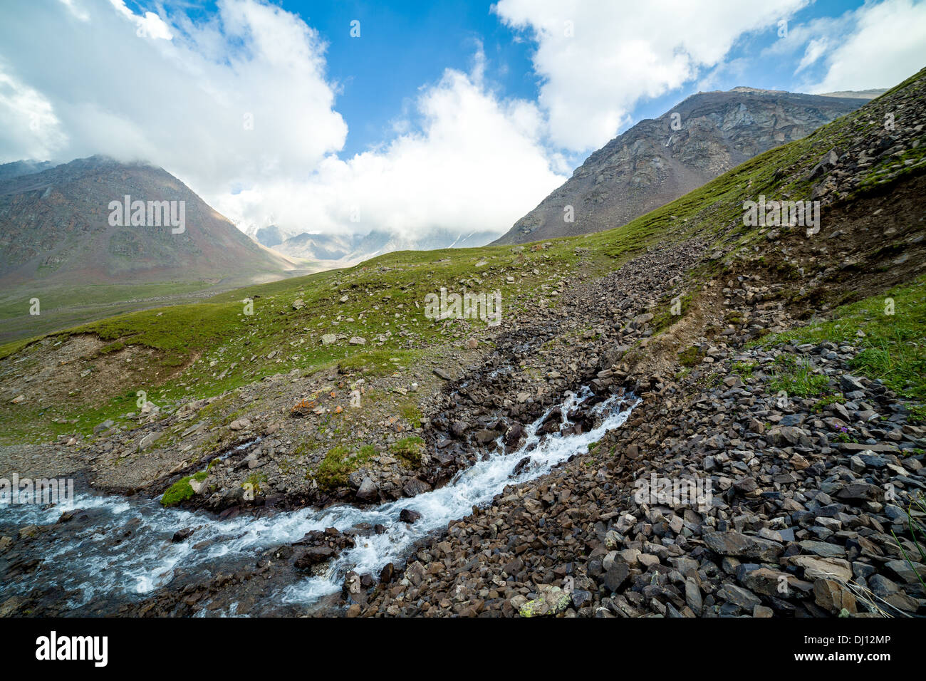 Stream flowing from the rock Stock Photo - Alamy