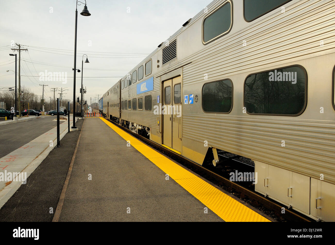 Suburban Train station platform and tracks Stock Photo - Alamy