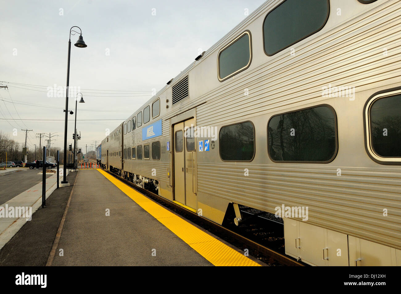 Suburban Train station platform and tracks Stock Photo - Alamy