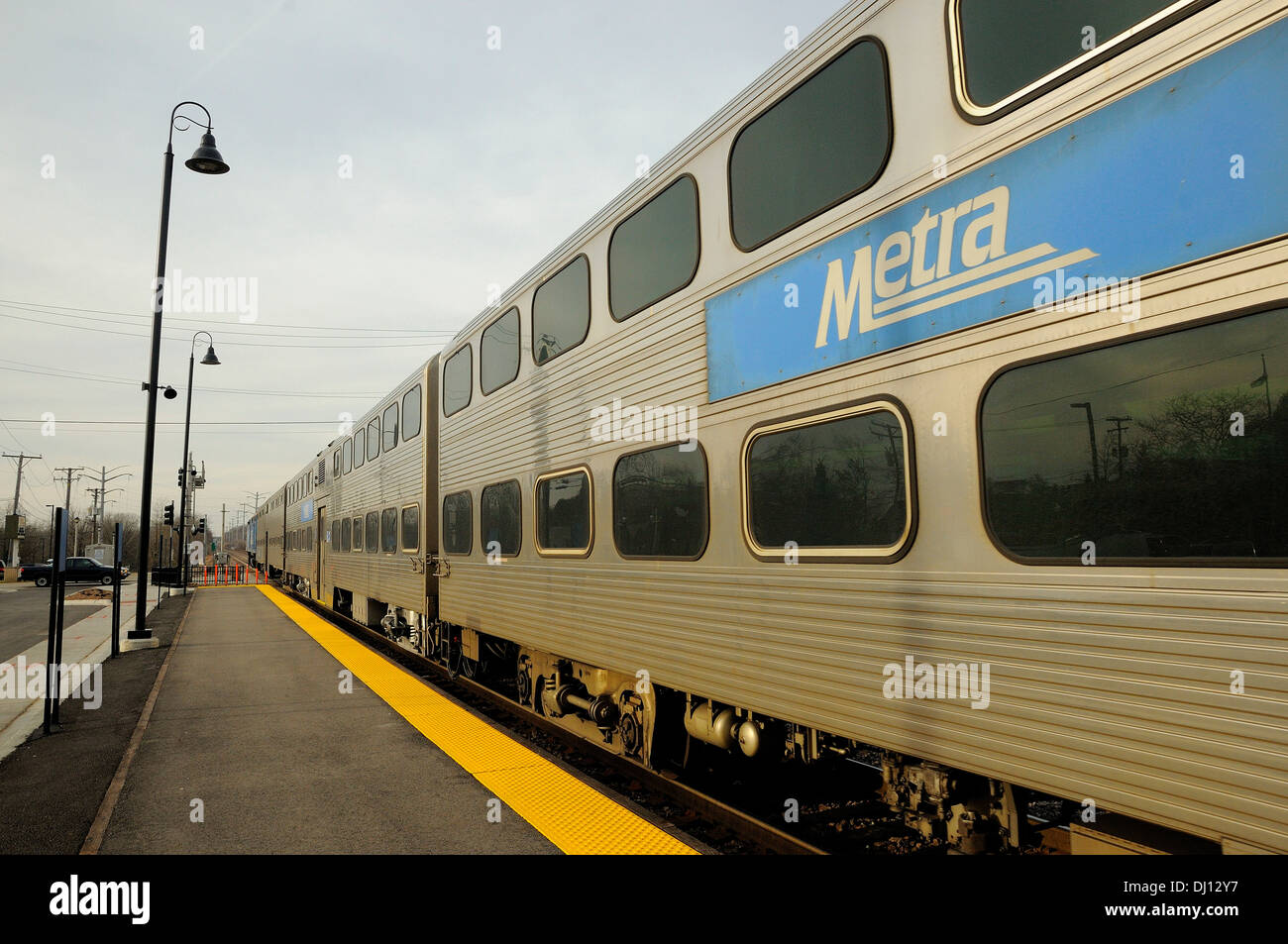 Suburban Train station platform and tracks Stock Photo - Alamy