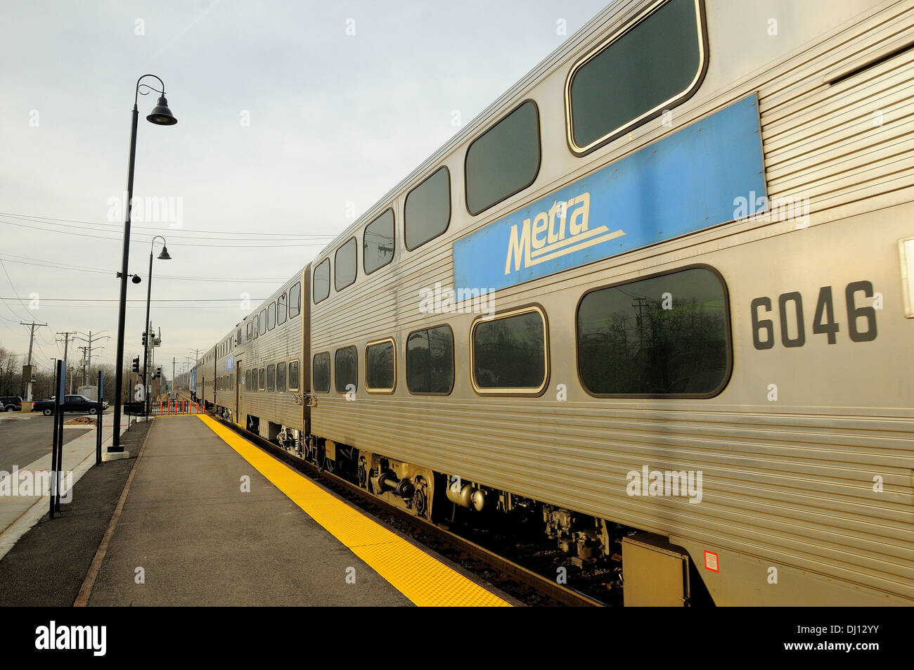 Suburban Train station platform and tracks Stock Photo - Alamy