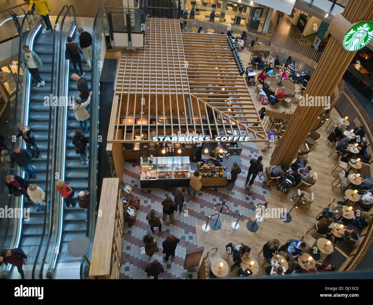 Starbucks coffee, café and escalators in a in a shopping center in ...