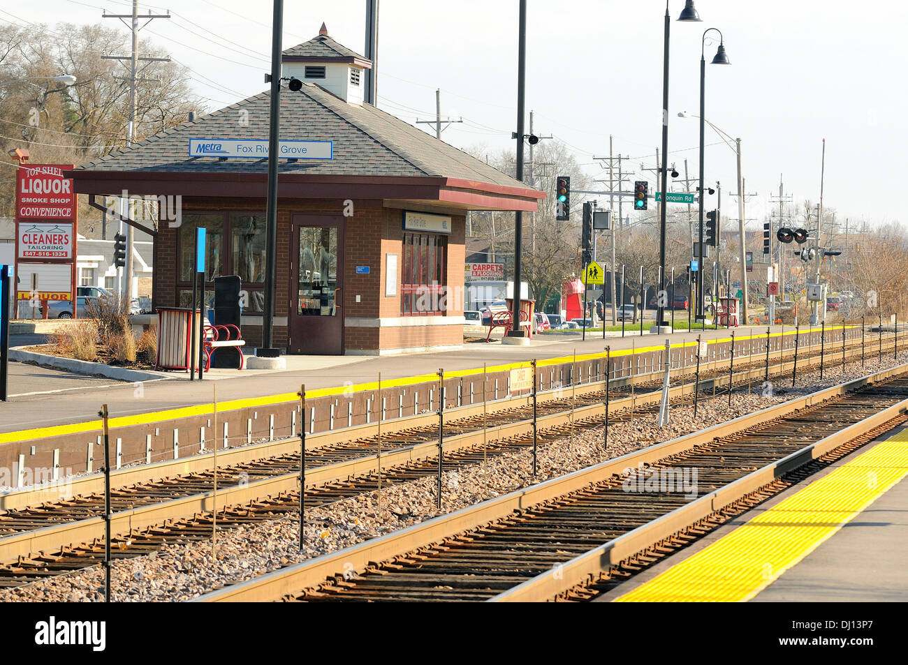 Suburban Train station platform and tracks Stock Photo - Alamy